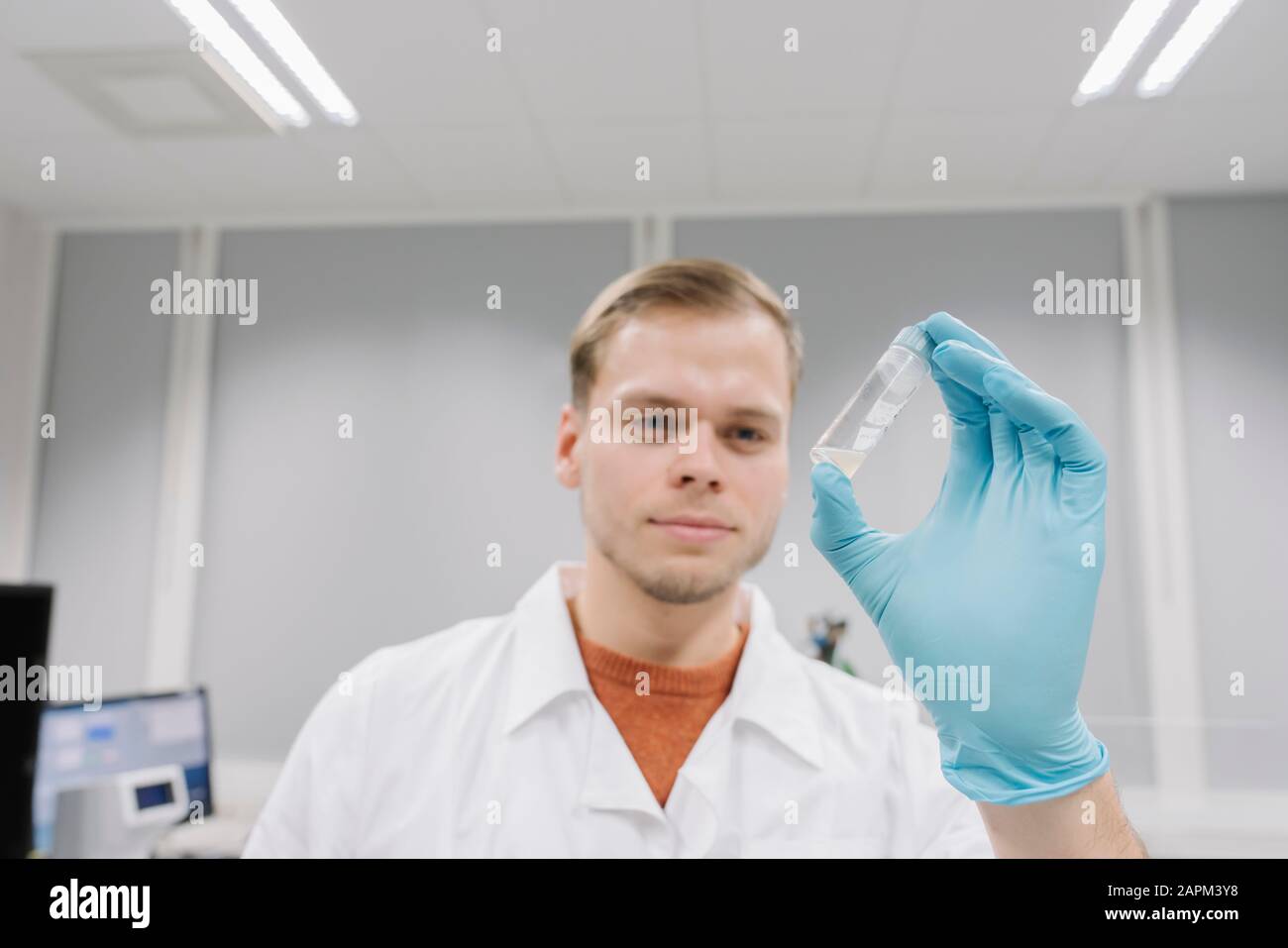 Portrait of a scientist analyzing a specimen in laboratory Stock Photo ...