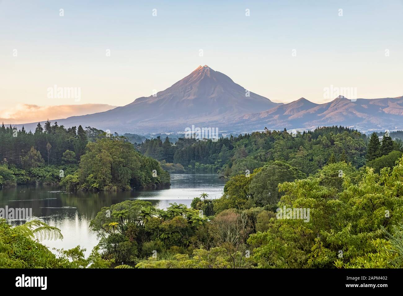 New Zealand, Scenic view of green forest surrounding Lake Mangamahoe ...