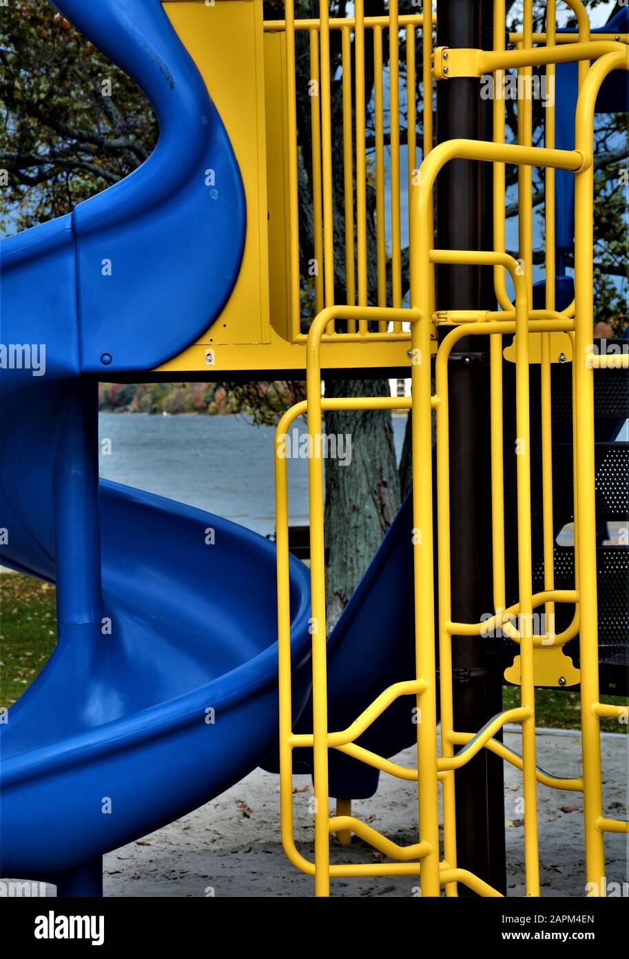 Blue and yellow playground equipment Stock Photo - Alamy