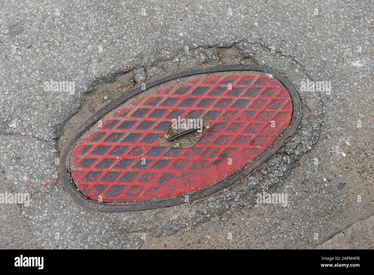 Red manhole cover hi-res stock photography and images - Alamy