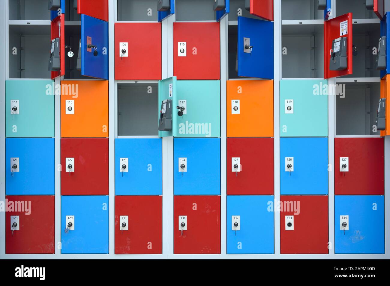 Rows of locker with doors in different colours Stock Photo - Alamy
