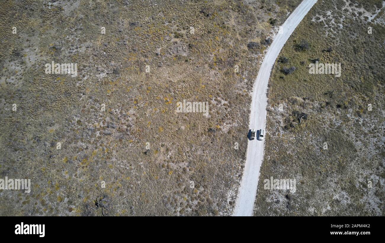 Aerial view of jeeps driving along a dirt track, Damaraland area ...