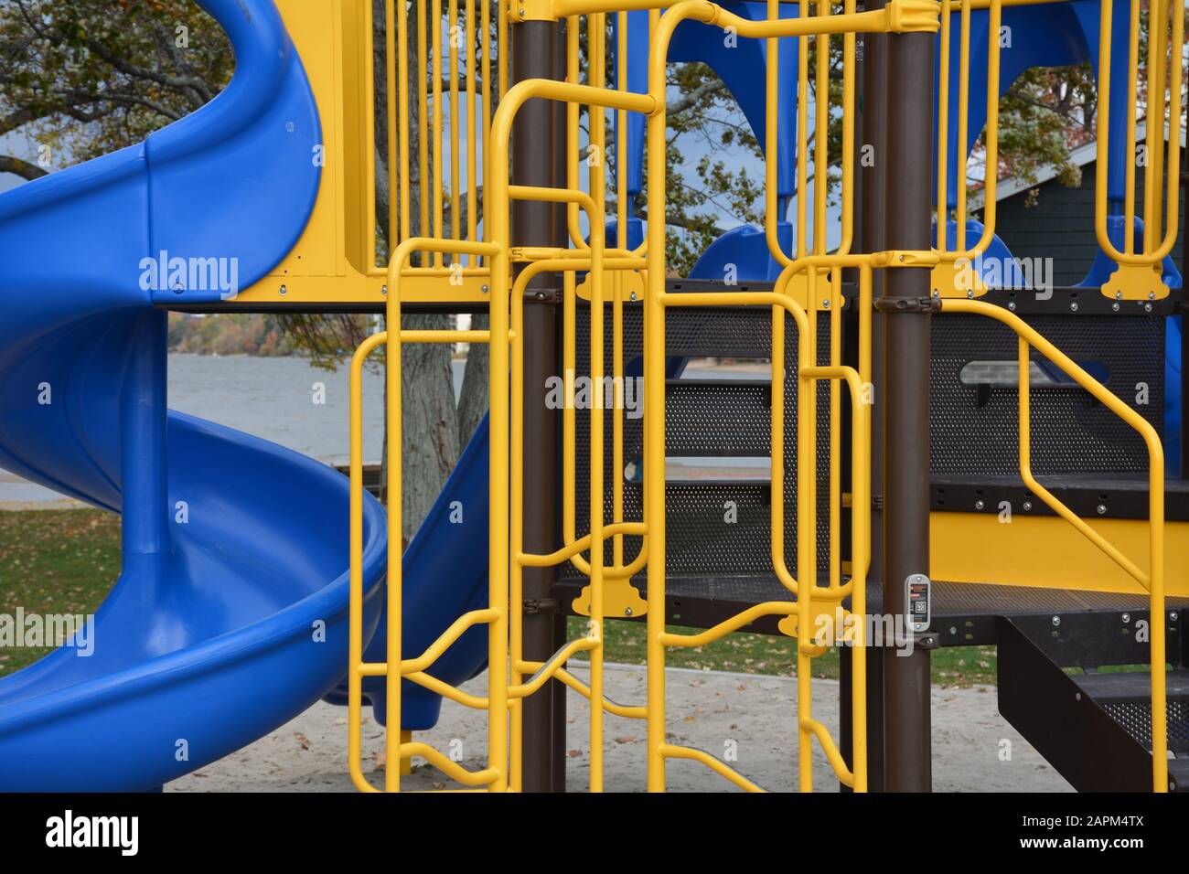 Blue and yellow playground equipment Stock Photo - Alamy