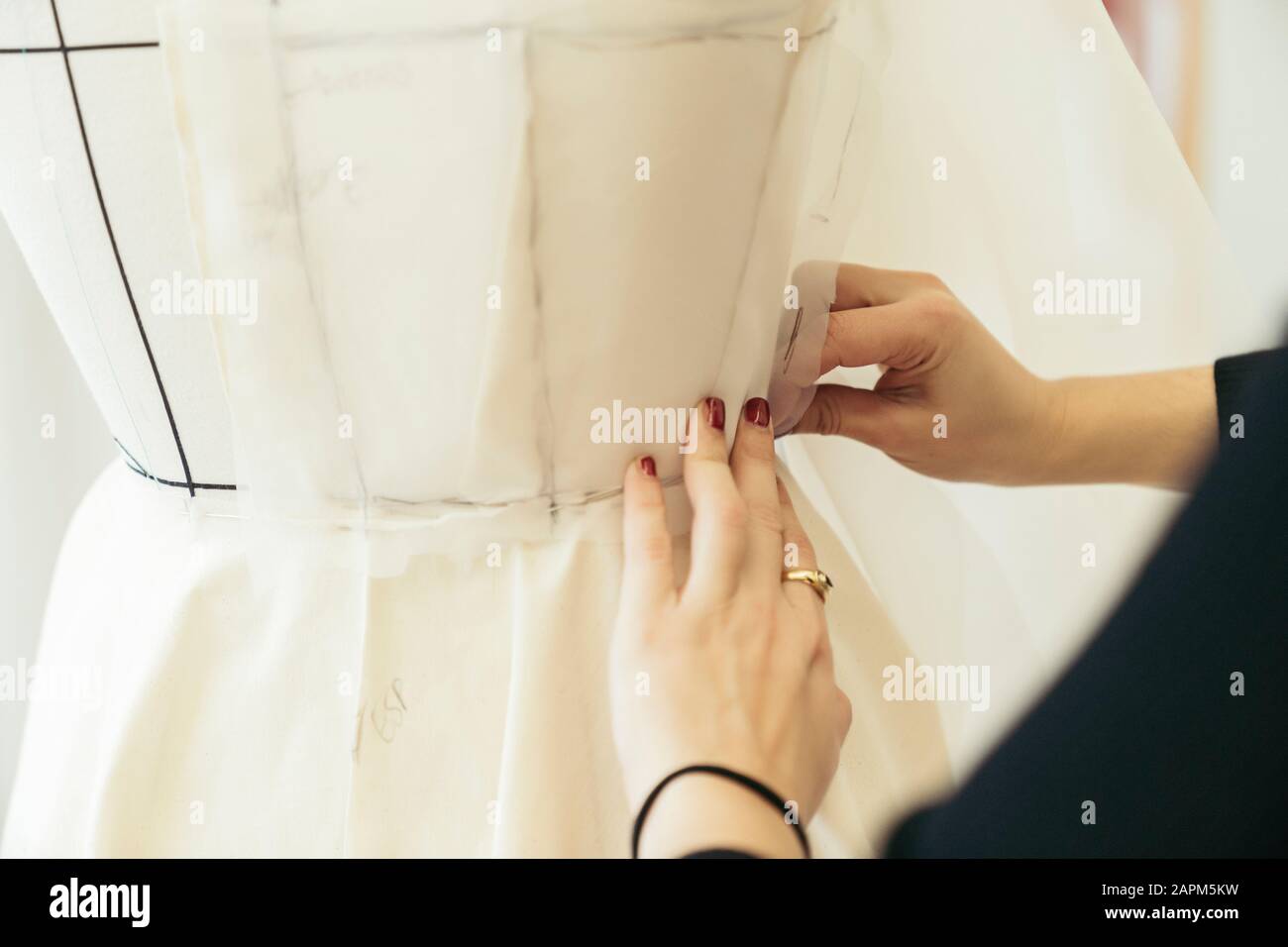 Fashion designer's hands at work Stock Photo - Alamy