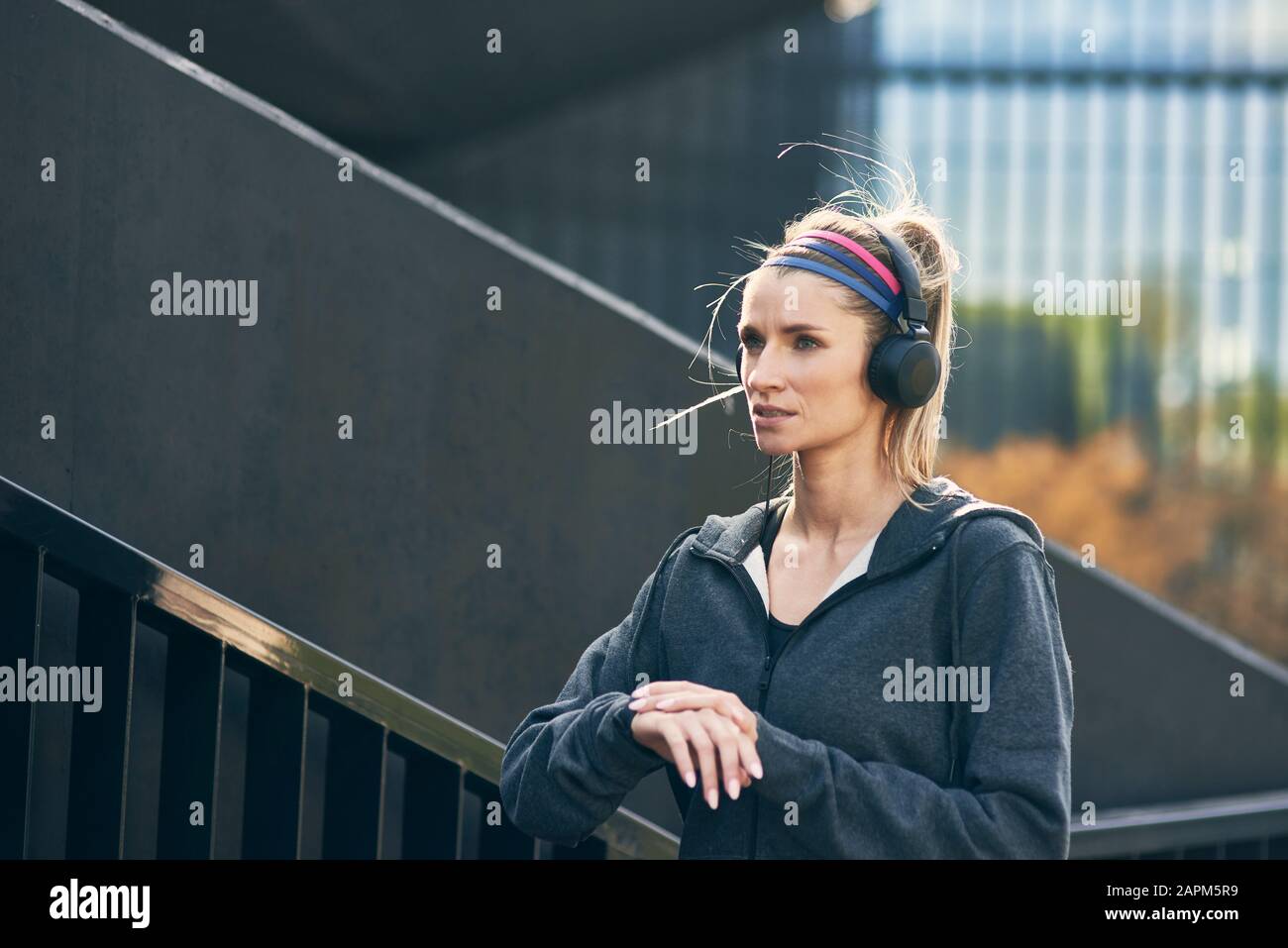 Runner taking short break during workout Stock Photo - Alamy