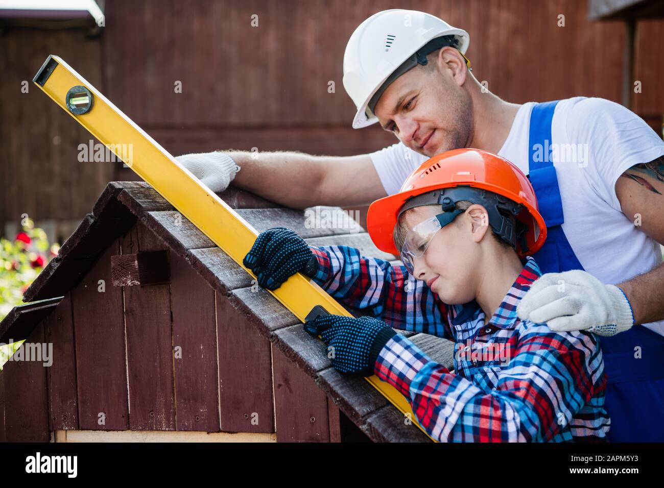Turning their visions into reality. Cheerful young male carpenter ...