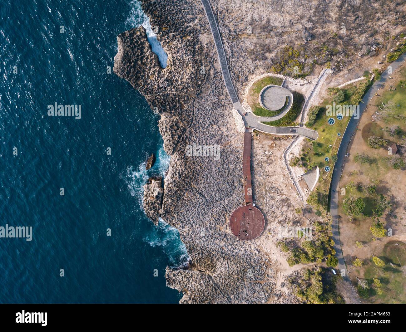 Indonesia, Bali, Nusa Dua, Aerial view of path and buildings at ocean ...