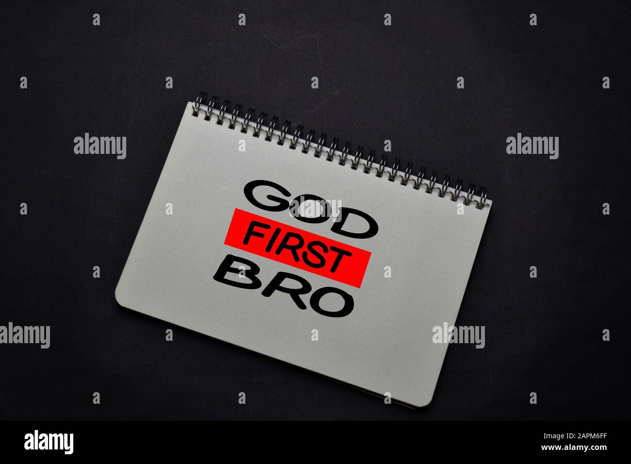 God First Bro write on a book isolated on office desk. Christian faith ...