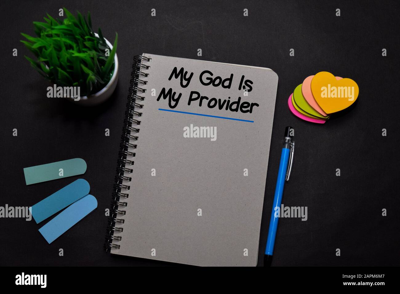 My God Is My Provider write on a book isolated on office desk ...