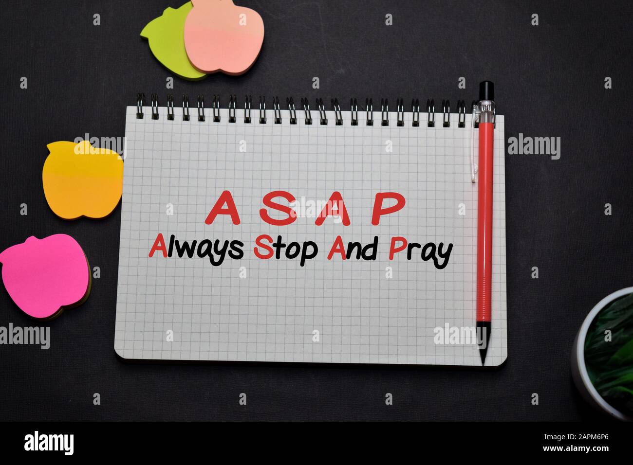 ASAP - Always Stop And Pray write on a book isolated on office desk ...
