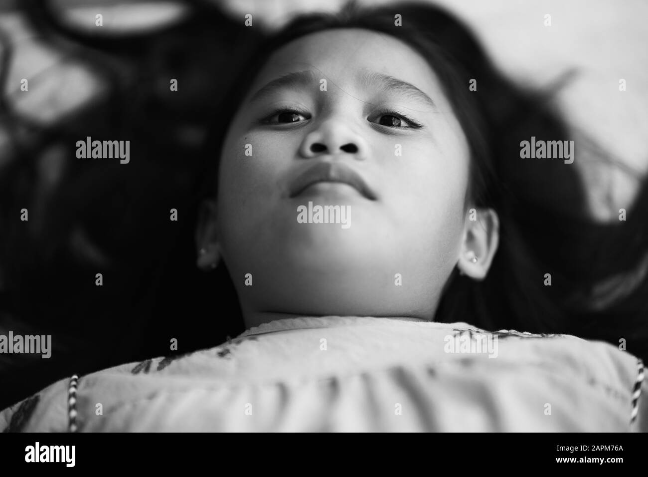 Portrait of asian young girl with long hair looking with serious face ...