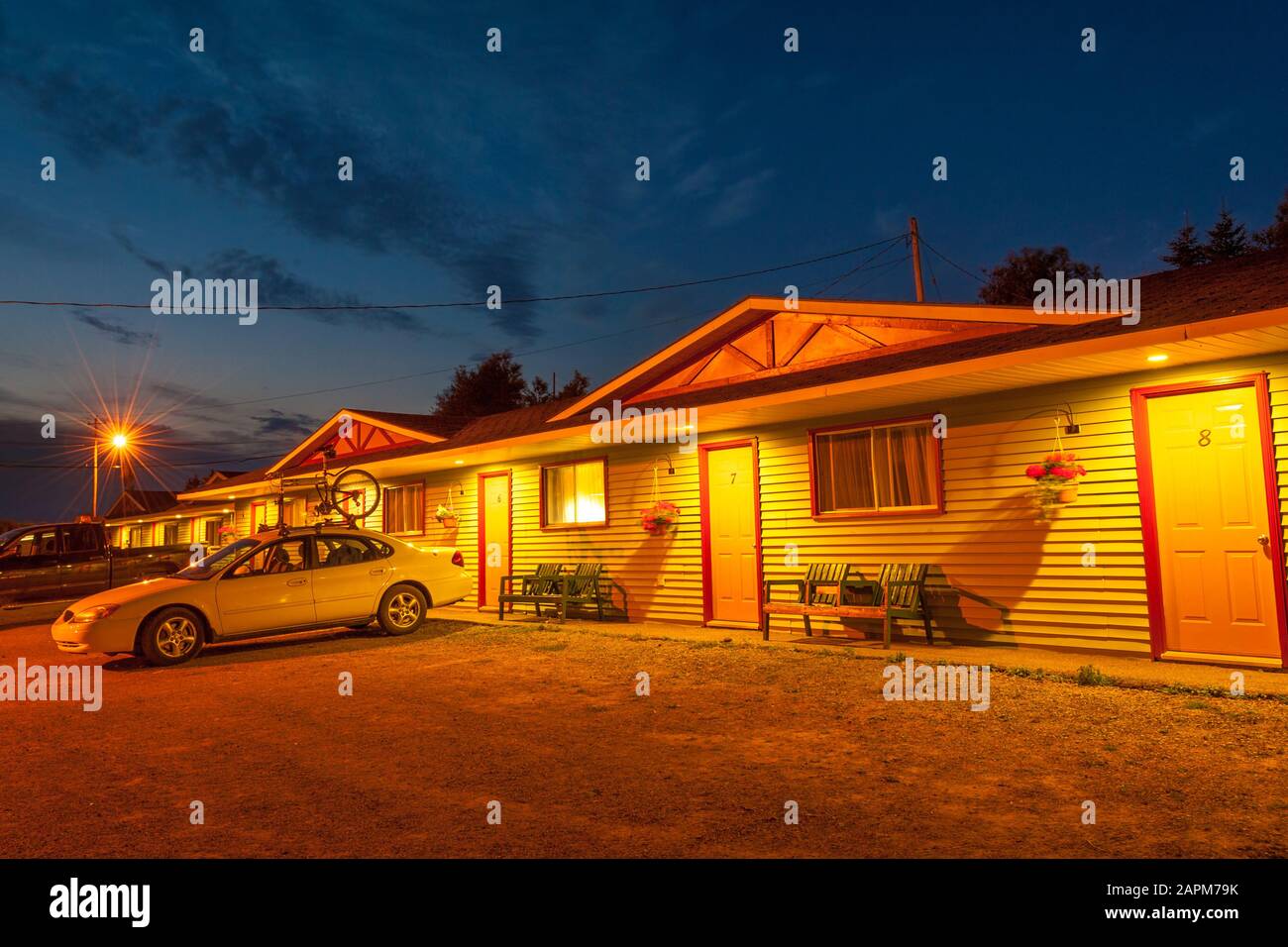 Typical small clean motel with parked cars in Nova Scotia at night ...
