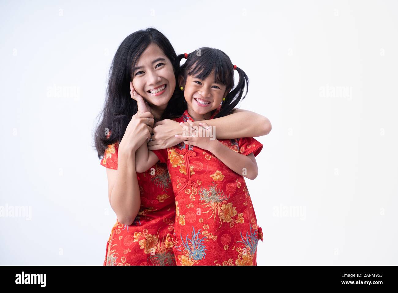 asian Chinese daughter and mother smile and hug together show happy ...