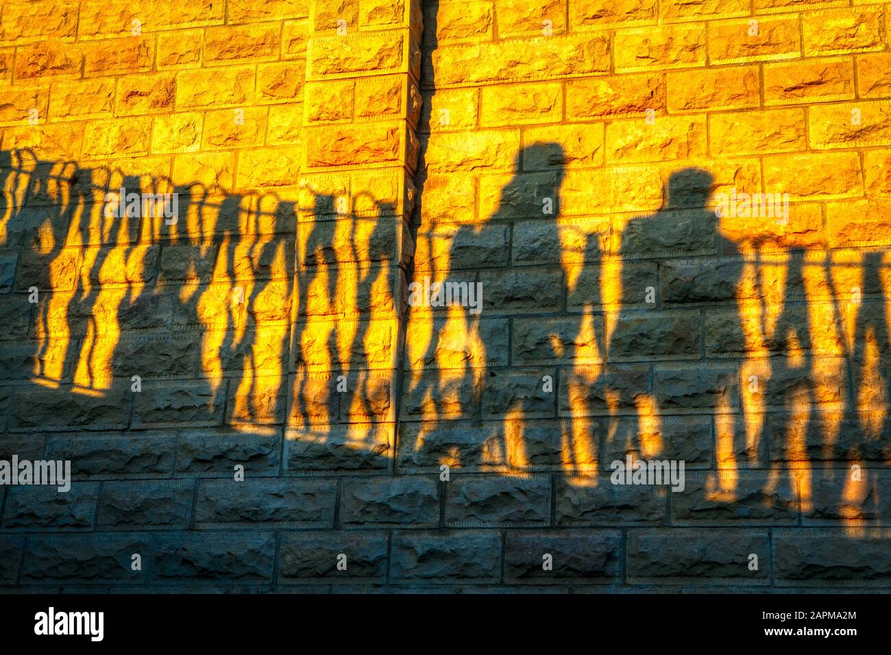 shadow of human silhouettes on the wall Stock Photo - Alamy