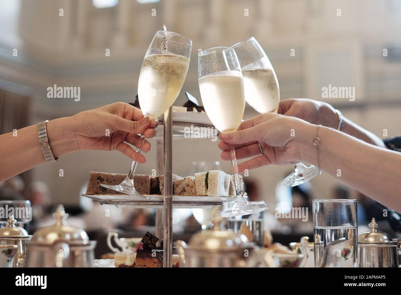 Afternoon tea High Tea with champagne, cakes, sandwiches, friends and ...