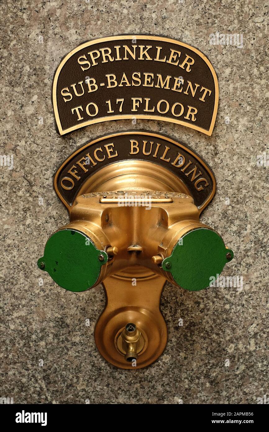 Polished brass green capped Standpipe system in New York City; on the ...