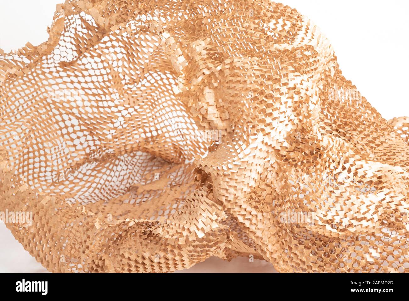 A close-up shot of a spread out brown kraft packaging paper filler set ...