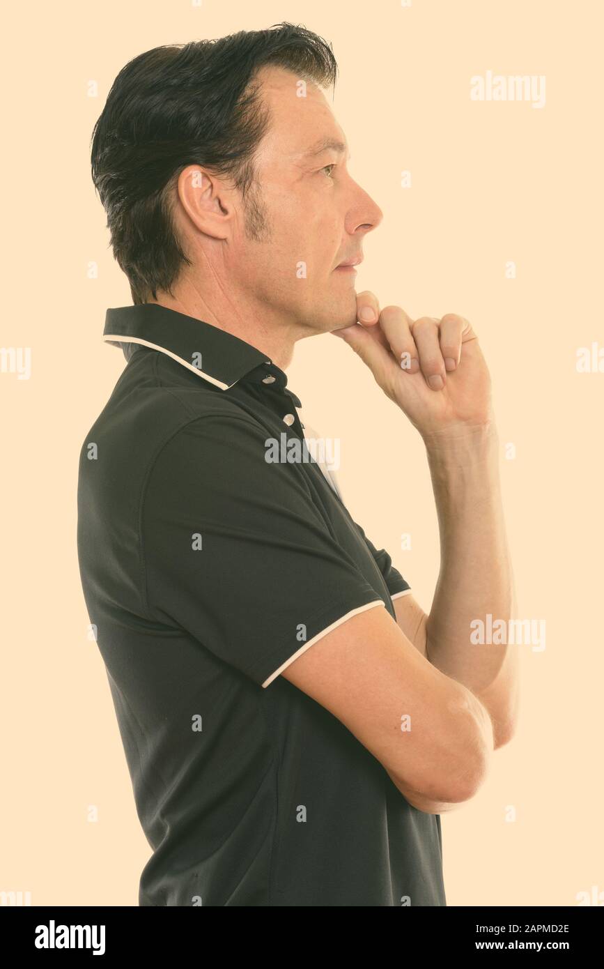 Profile view of mature handsome man thinking Stock Photo - Alamy
