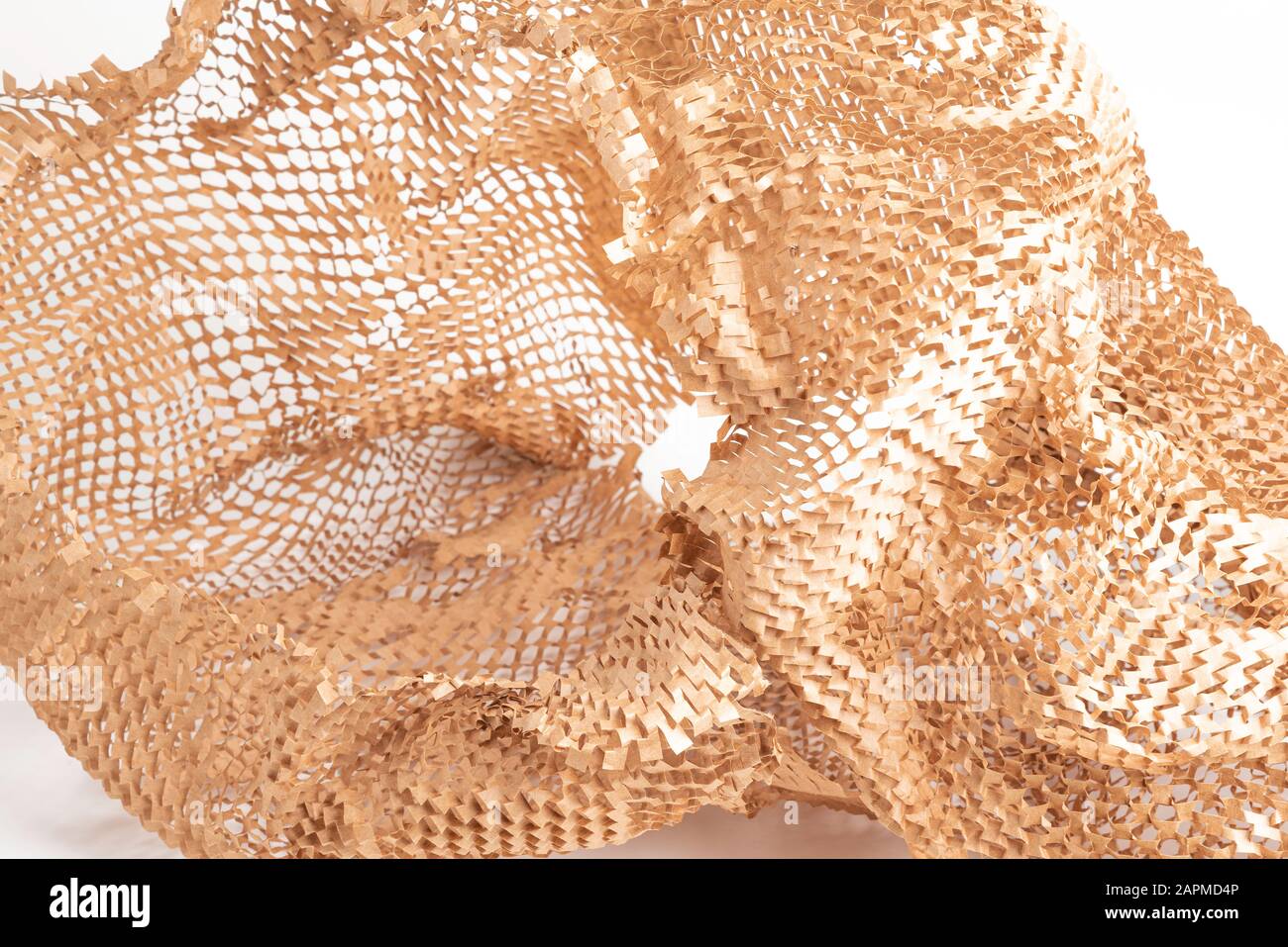 A close-up shot of a spread out brown kraft packaging paper filler set ...