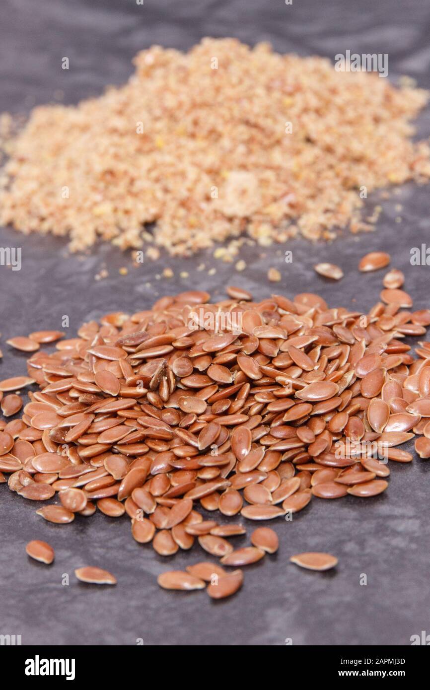 Linseed on old rustic board. Healthy food containing natural vitamins ...