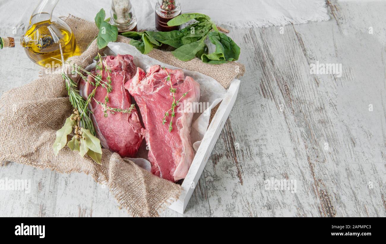 The meat cutlet is ready for marinating and cooking on the barbecue ...