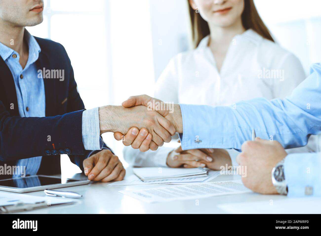 Business people shaking hands at meeting or negotiation, close-up ...