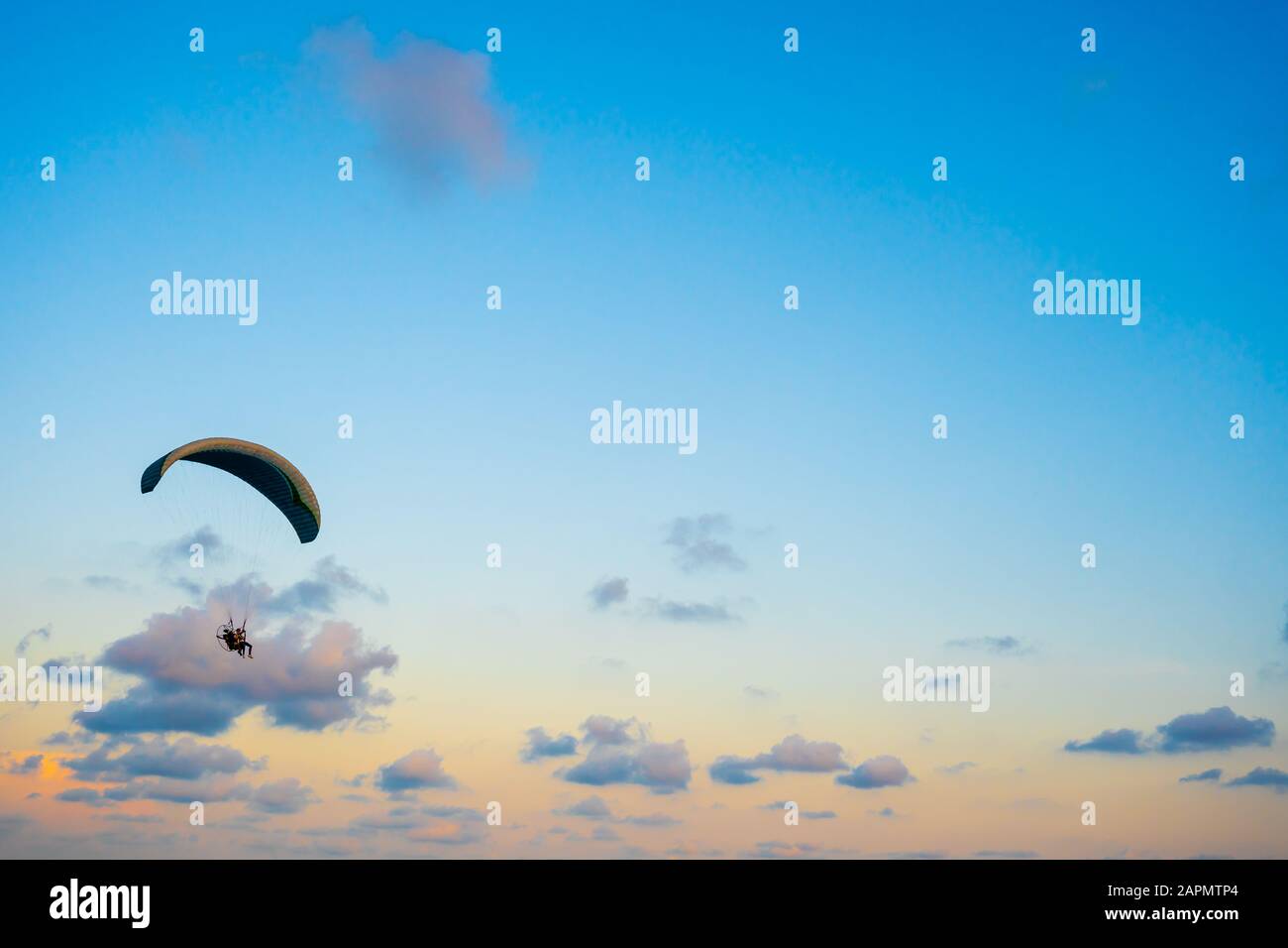 Paraglider flying on background hi-res stock photography and images - Alamy
