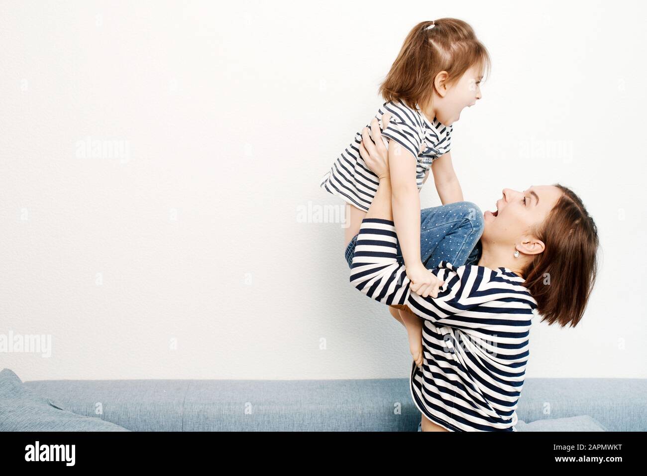 Woman raising hands above head hi-res stock photography and images - Alamy