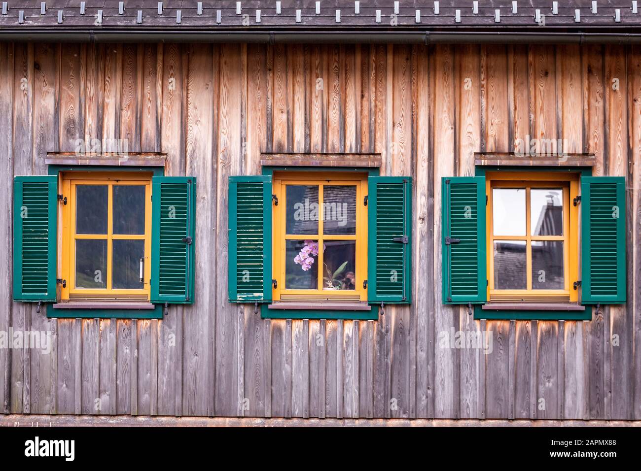 Windows at the famous Hallstatt mountain village in the Austrian Alps ...