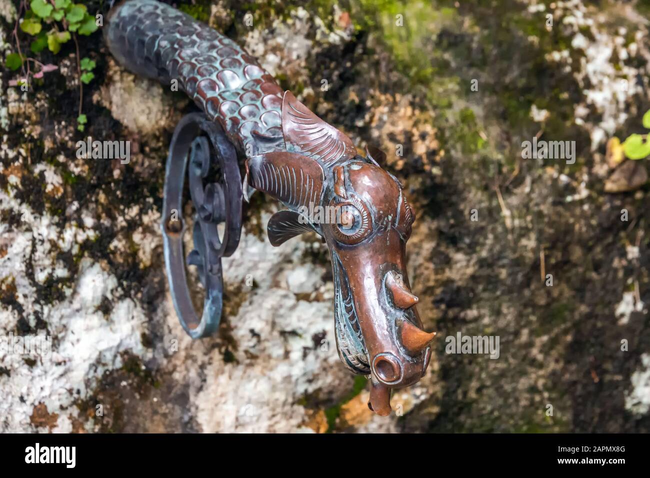 Dragon shaped water drainage in the famous Hallstatt mountain village ...
