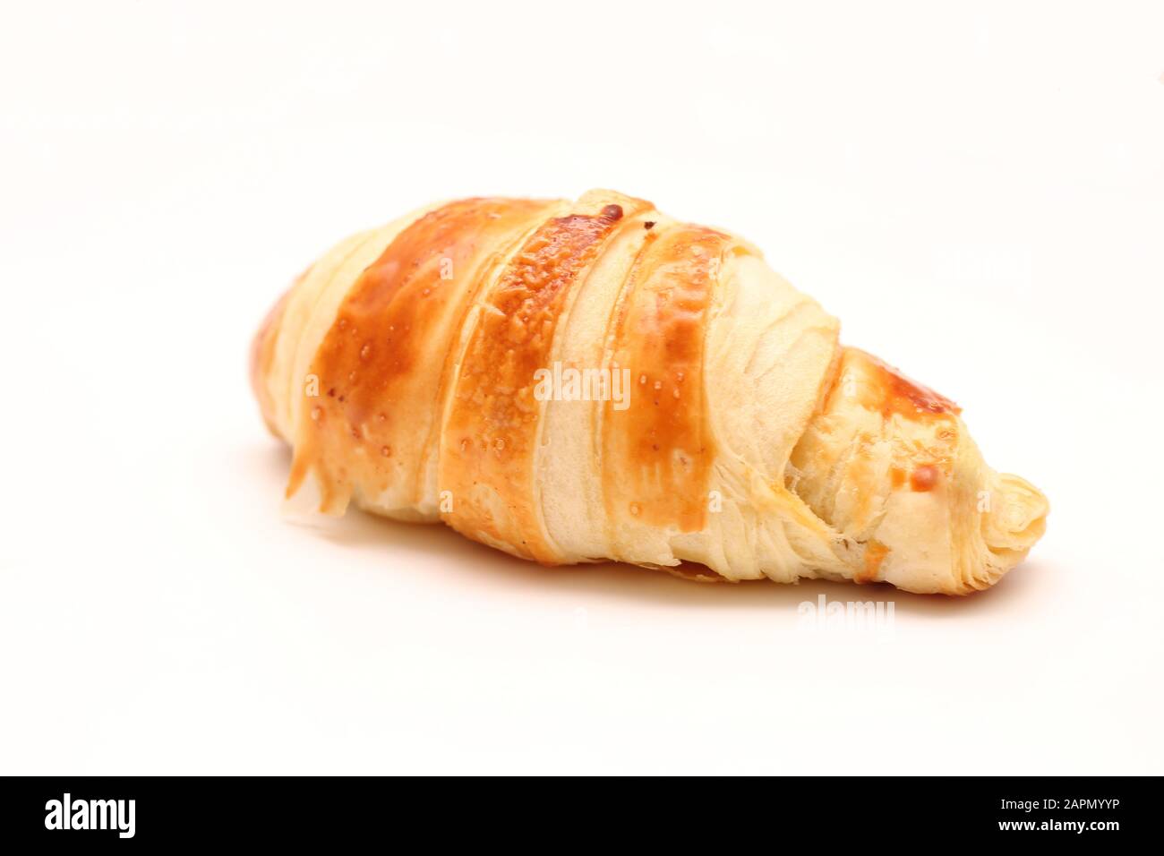 isolated lone french croissant on white background Stock Photo - Alamy