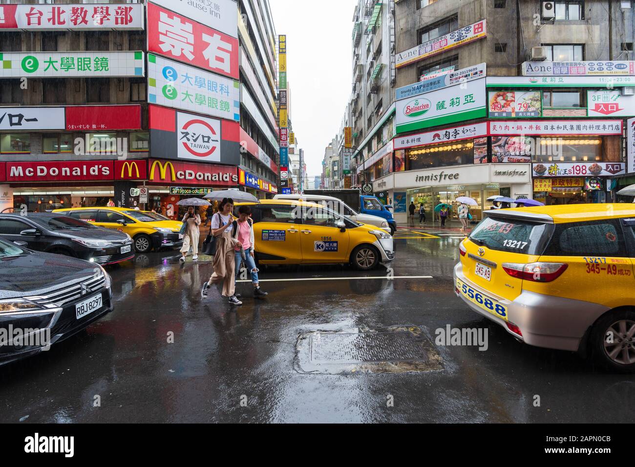 Taipei, Taiwan- 11 June, 2019: Traffic on road with falling rain in ...