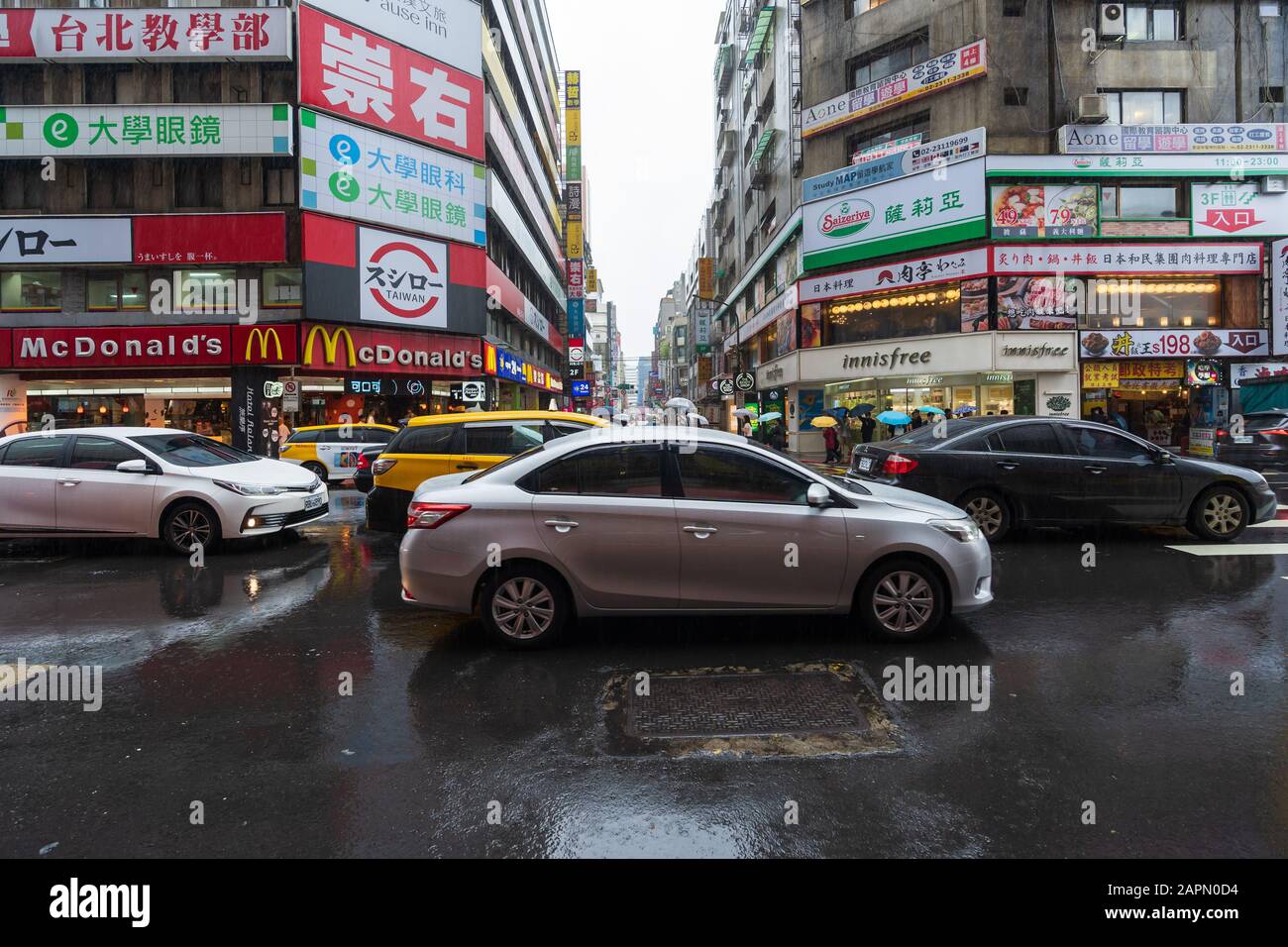 Taipei, Taiwan- 11 June, 2019: Traffic on road with falling rain in ...