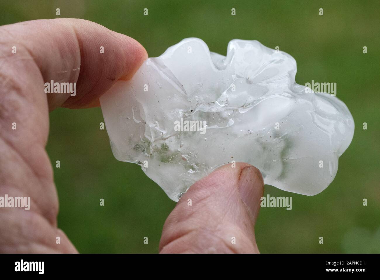 Hail stone held in hand after thunder storm Stock Photo - Alamy
