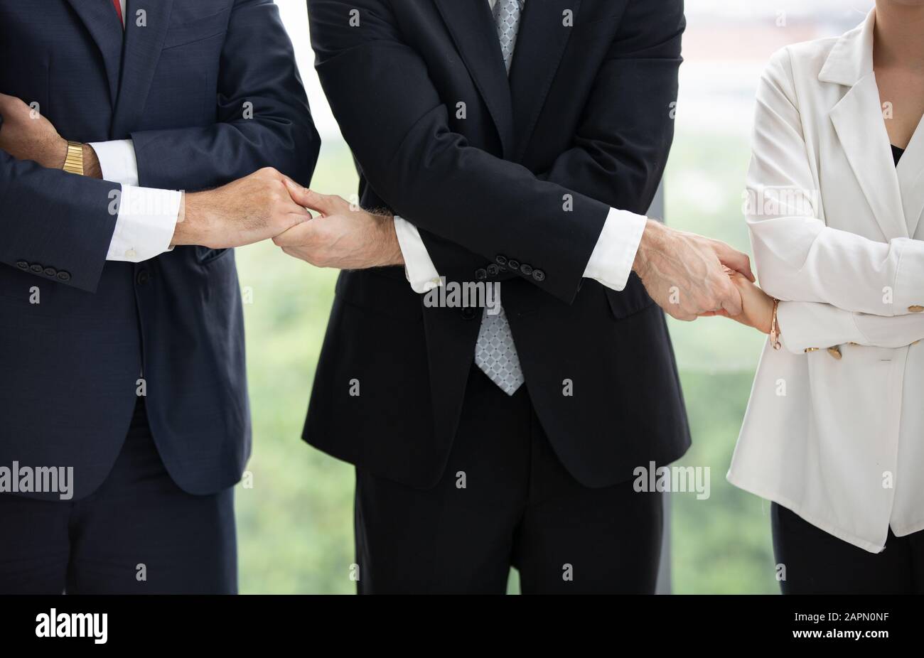 Business people give hands stack or holding each other for Unity and ...