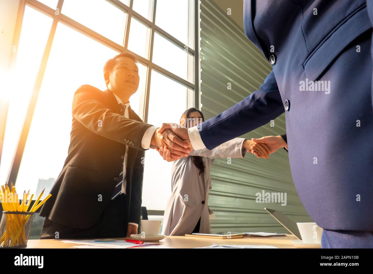 Business people give hands stack or holding each other for Unity and ...