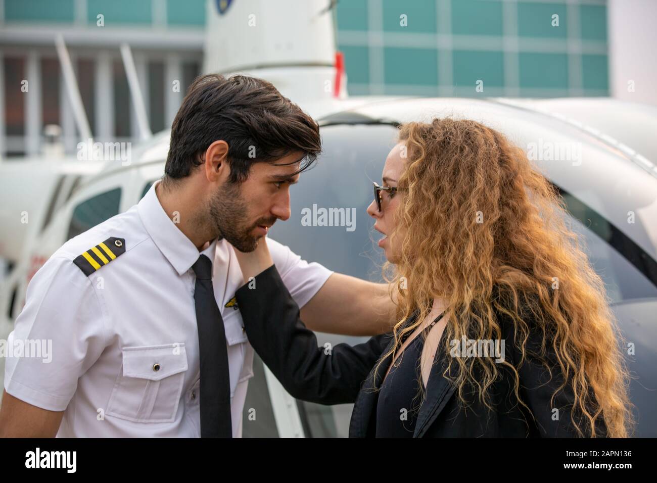 portrait of man commercial pilot at Airport terminal Stock Photo - Alamy