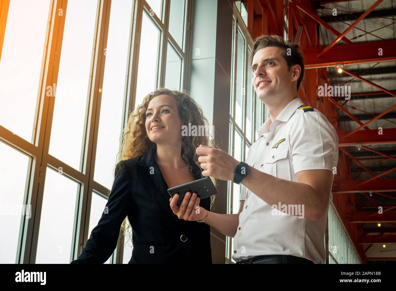 portrait of man commercial pilot at Airport terminal Stock Photo - Alamy