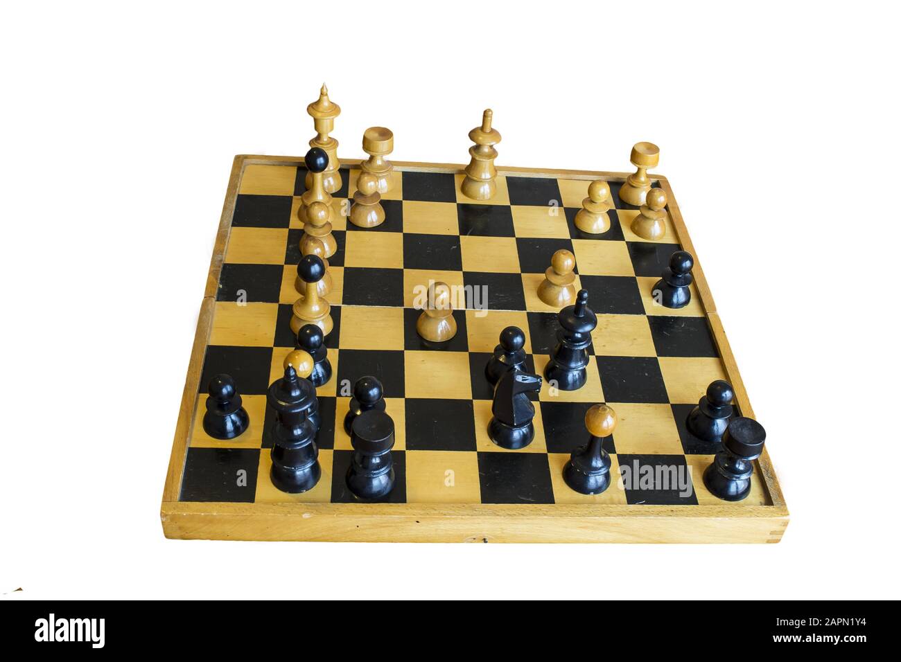 Tilted shot of a chess game in progress against a white background ...