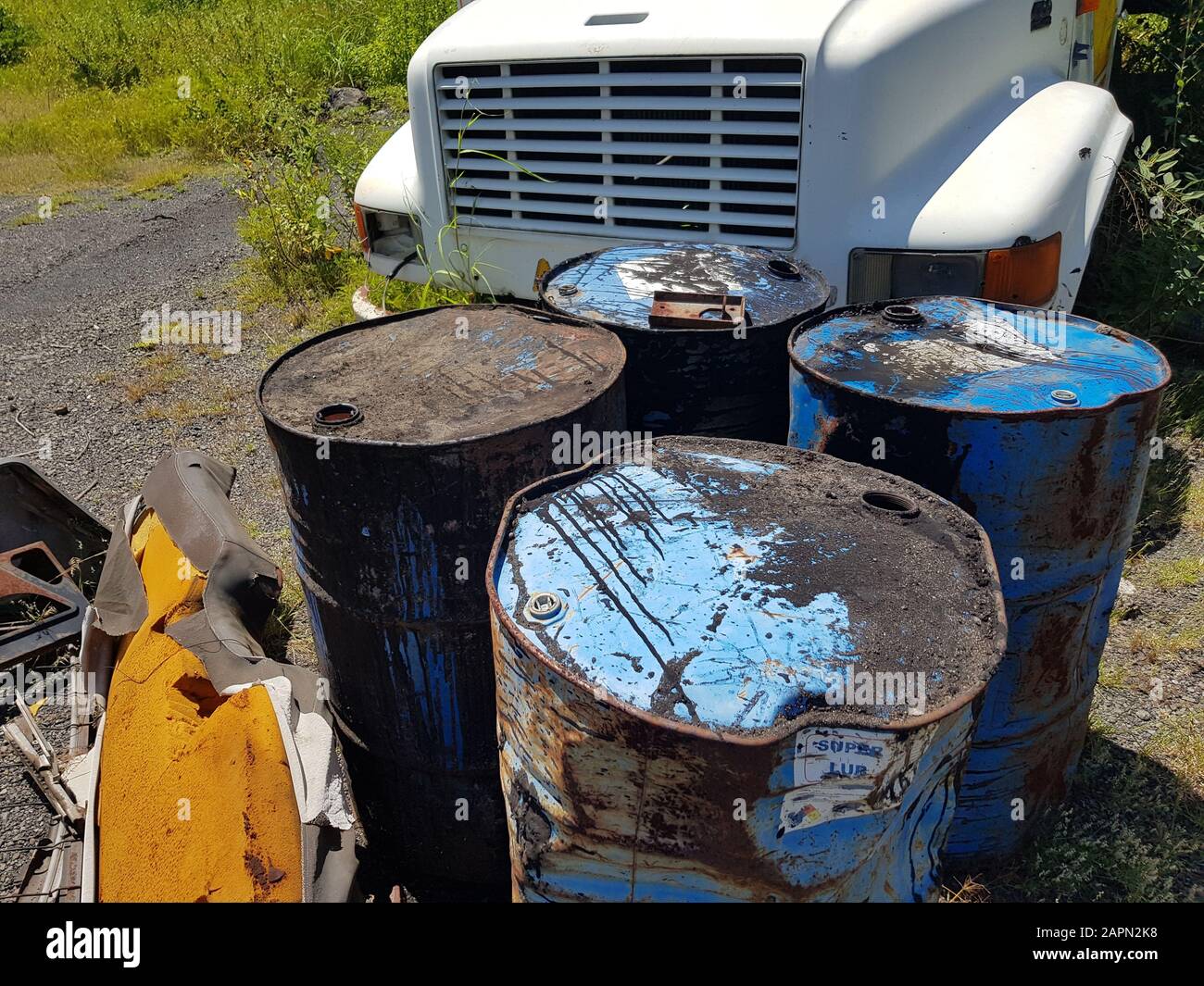 SAN SALVADOR, EL SALVADOR - Jan 13, 2020: Discarded metal barrels ...