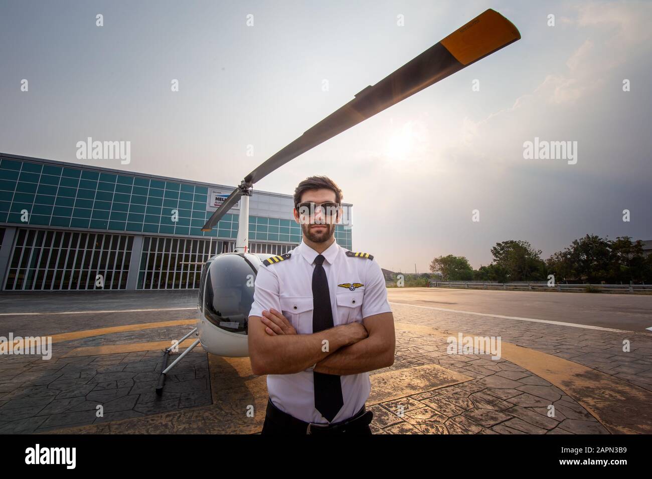 Shot of a mature Helicopter pilot using a headset while traveling in a ...