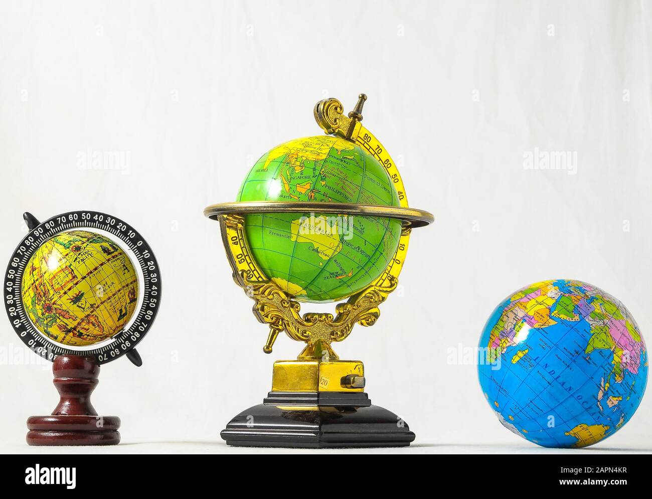 Landscape shot of three different globe models with a white color in ...