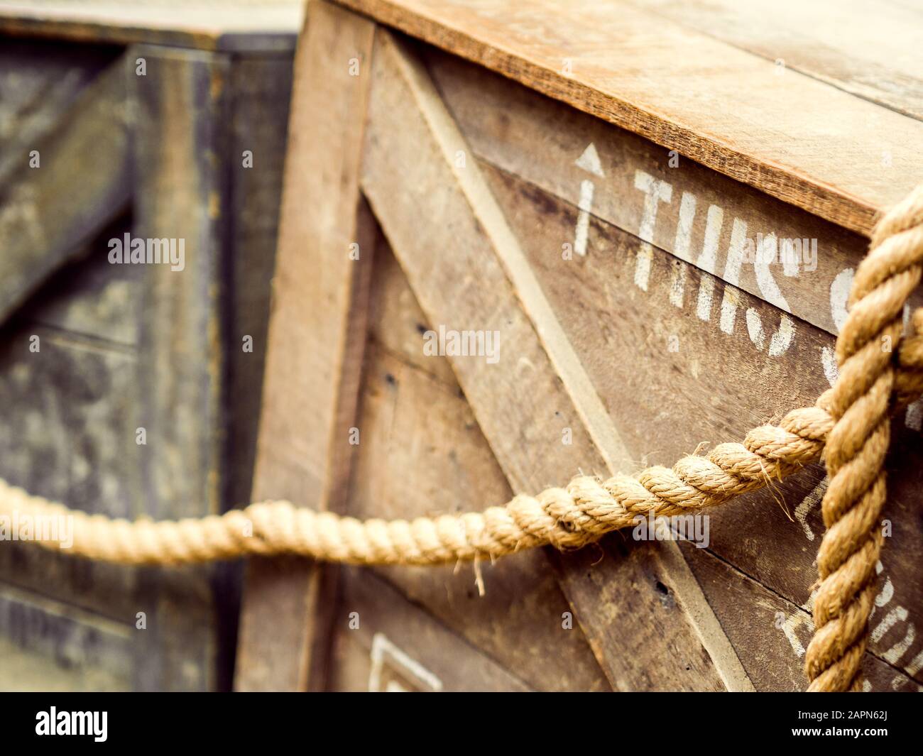 Closeup shot of shipping wooden crate box with a rope and a signage ...
