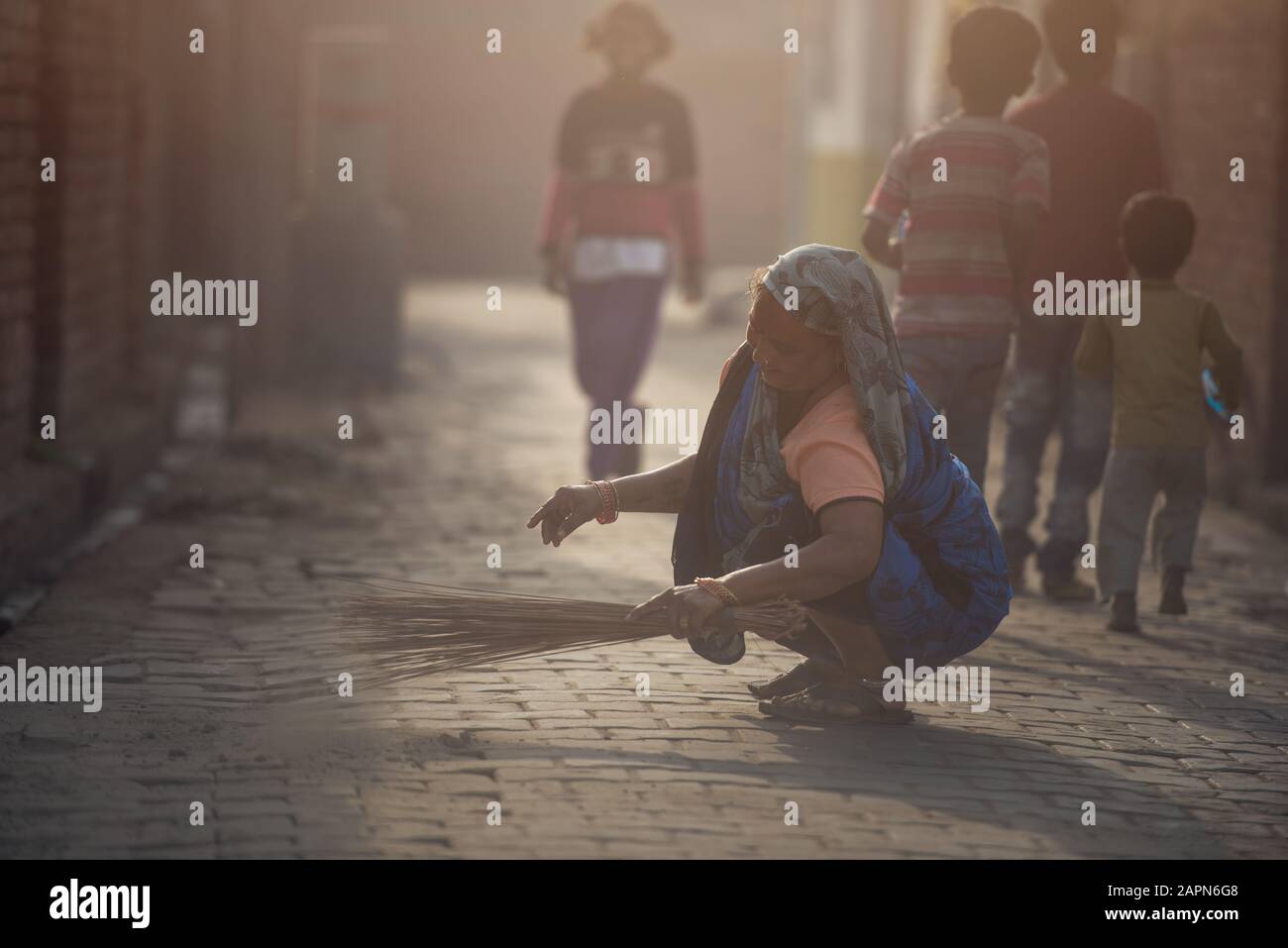 Indian woman cleaning street hi-res stock photography and images - Alamy