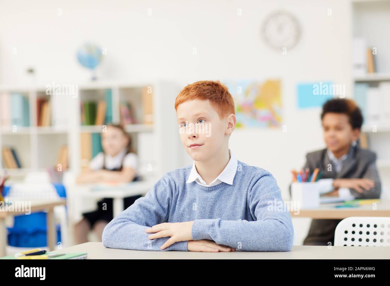 Cute boys classmates in classroom hi-res stock photography and images ...
