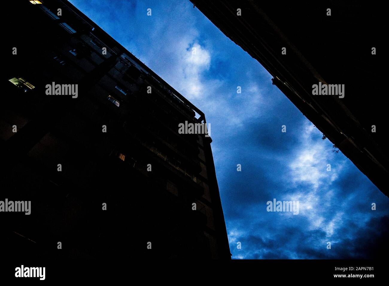 View of the blue and clear sky and two buildings standing next to each ...