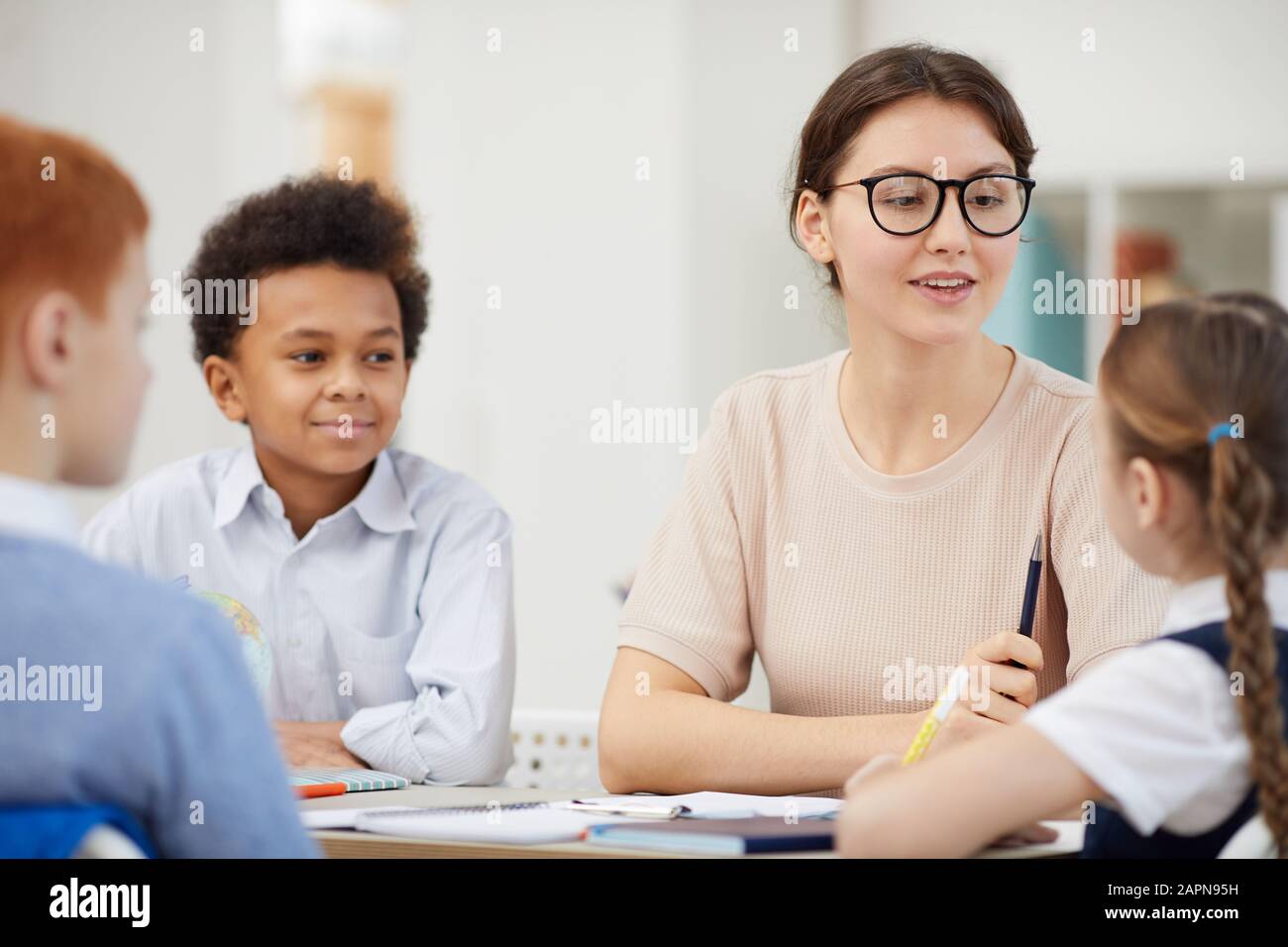 Children teacher school talking table hi-res stock photography and ...