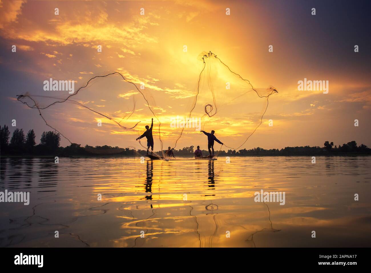 Asian Fishermen on boat fishing at lake, Thailand countryside Stock ...