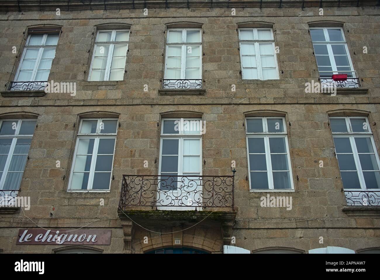 Traditional french stone building with many windows Stock Photo - Alamy