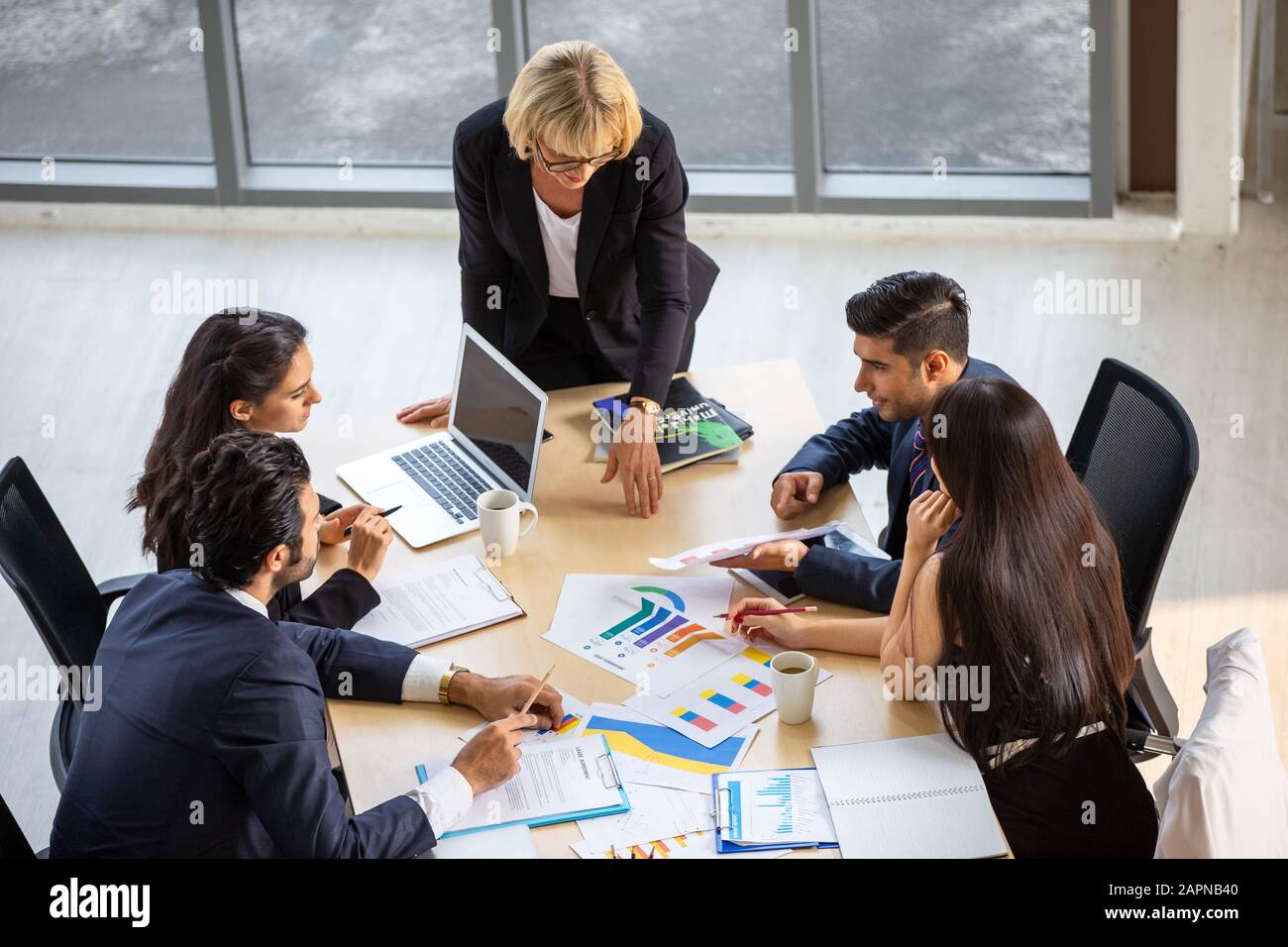 young business team working together at office. Manager pointing at a ...